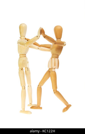 Two wooden artist's manikins dancing isolated against white Stock Photo ...