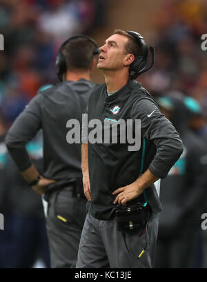 Miami Dolphins head coach Adam Gase talks to side judge Terry Brown ...