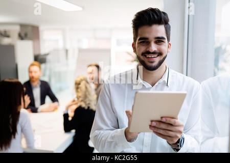 Happy handsome guy drawing portrait of his girlfriend while sitting on ...