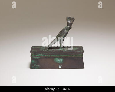 Falcon in double crown surmounting a shrine shaped box for an animal ...