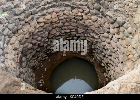 Deep ancient well inside Stock Photo - Alamy
