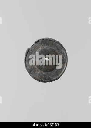 Lead disk with a hole in the center, 6th–5th century B.C Stock Photo ...