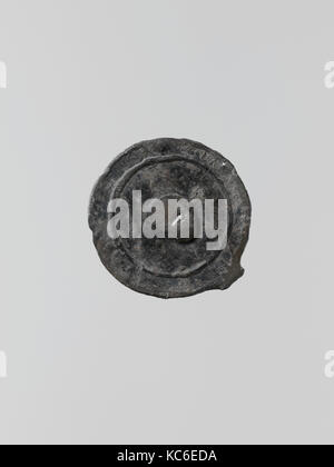 Lead disk with a hole in the center, 6th–5th century B.C Stock Photo ...