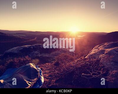 Beautiful awakening in rocks. Sleeping in nature in sleeping bag. View ...