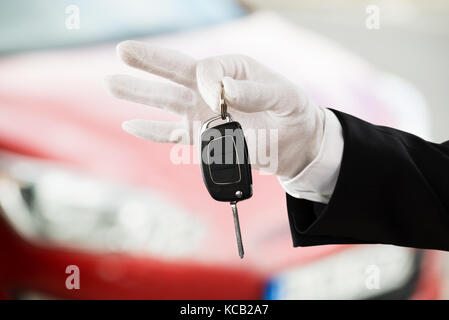 Valet Boy Hand Holding Car Key Outside The Car Stock Photo - Alamy