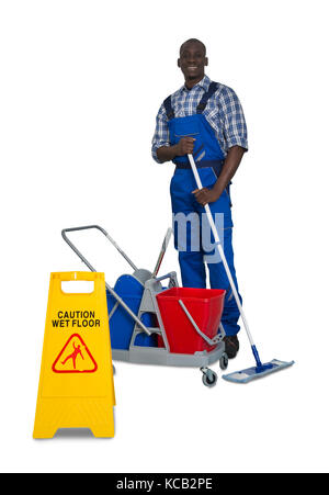 handsome African American man sweeping on white background Stock Photo ...