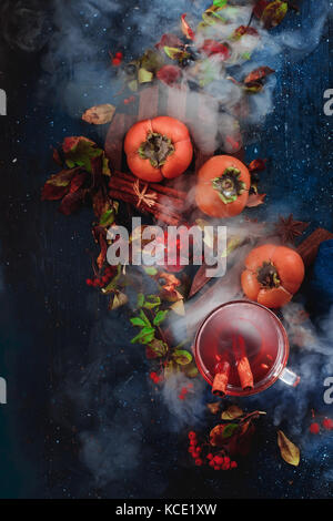 Delicious orange persimmons on wooden table Stock Photo - Alamy