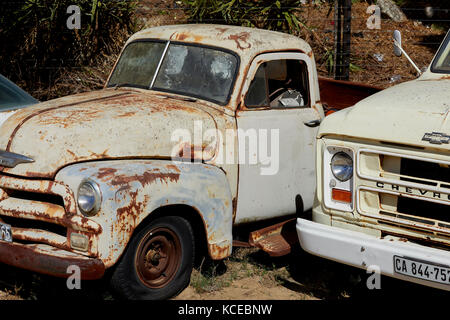 rusty old chevrolet van in a junk yard in the desert in Phoenix Arizona ...