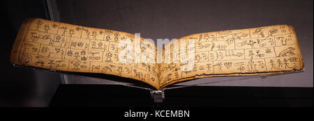 Pages from a Naxi manuscript. The manuscript shows both Naxi and Dongba ...