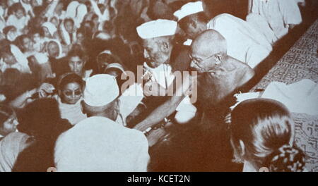 Mohandas Karamchand Gandhi collecting funds for Harijans at a railway ...