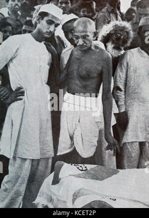 Mohandas Karamchand Gandhi collecting funds for Harijans at a railway ...
