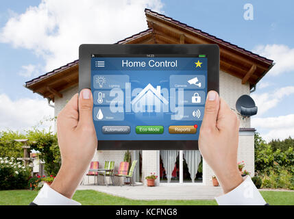 Hand holding tablet with online security and data protection concept ...