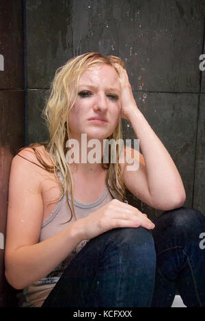 Girl showing signs of depression and mental illness in a shower Stock ...