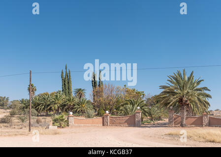 STAMPRIET, NAMIBIA - JULY 5, 2017: The C15-road becomes a gravel road ...
