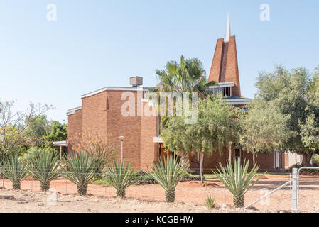 GOCHAS, NAMIBIA - JULY 5, 2017: A street scene with a supermarket ...