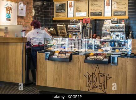 Staff Working Behind Counter In Busy Coffee Shop Stock Photo - Alamy