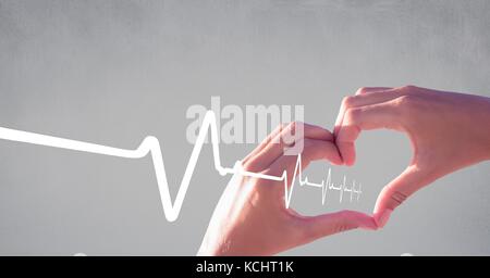 Digital composite of Heart beat over hands holding heart Stock Photo ...