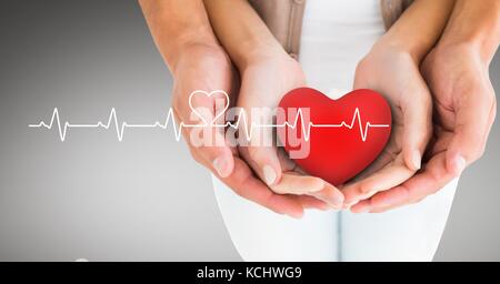Digital composite of Heart beat over hands holding heart Stock Photo ...