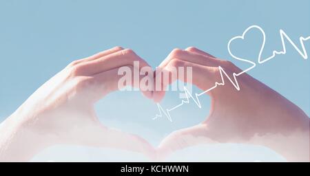 Digital composite of Heart beat over hands holding heart Stock Photo ...
