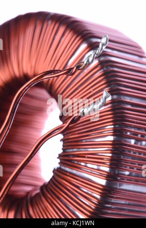 Transformer copper coil isolated on a white background Stock Photo - Alamy