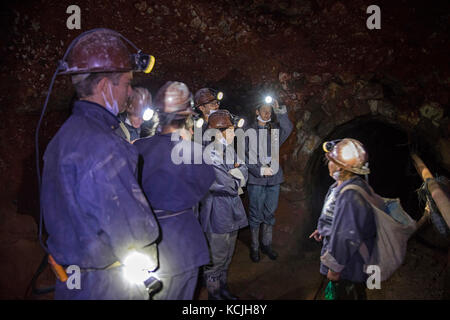 Tourists with guide visiting silver mine on the Cerro Rico de Potosi ...