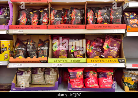 bags of crisps chips on sale in shop Stock Photo - Alamy
