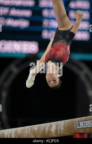 Brooklyn Moors of Canada competes in the balance beam event of the ...