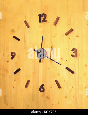 wall clock on wooden background Stock Photo - Alamy