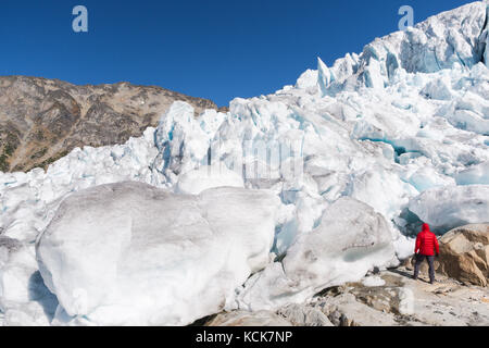 Hiker in front of Matier Glacier in Joffre Lakes provincial park ...