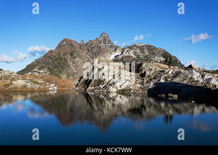 The Mt. Septimus massif is refected in a large tarn, near Cream Lake in ...