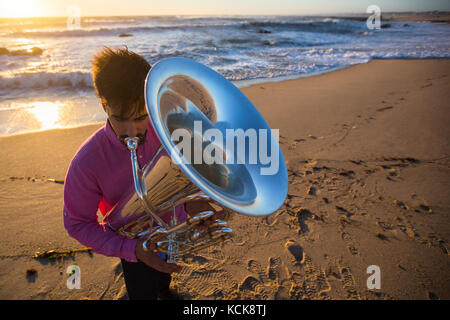 Musician play to tuba on the Sea shore Stock Photo - Alamy