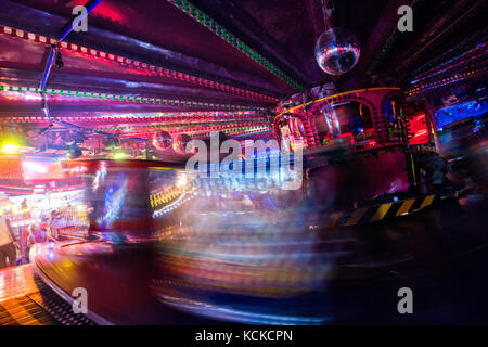 Fairground rides. The Waltzer ride at Goose Fair, Nottingham, England ...