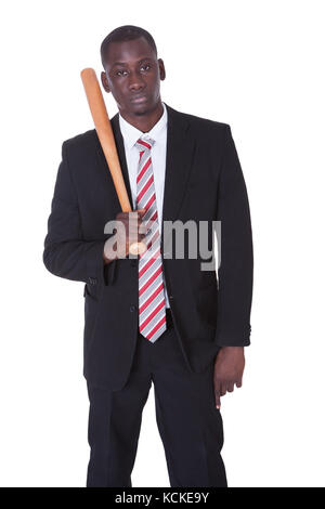 Businessman with baseball bat isolated on white Stock Photo - Alamy