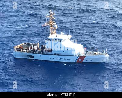 The crew of the coastal patrol boat USCGC Haddock (WPB 87347) tows a ...