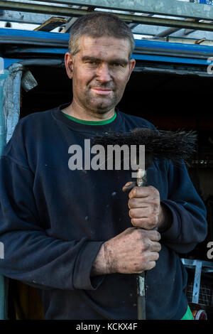 Chimney sweep covered in soot with dirty hands and face Stock Photo - Alamy