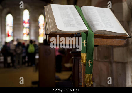 open pages from the Holy Bible on a lectern in a Church Stock Photo - Alamy