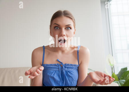 Confused beautiful woman with questioning gesture. Pensive funny woman ...