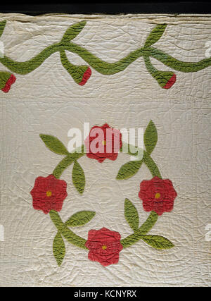 Applique quilt in a variant of the Kentucky Rose design using red ...