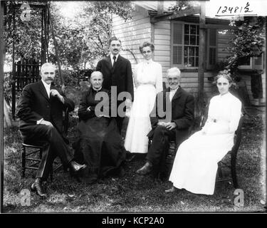A portrait of the Alfred Garrod family in 1913, standing in front of ...