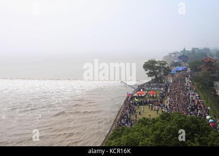 Haining, China's Zhejiang Province. 7th Oct, 2017. People watch one ...