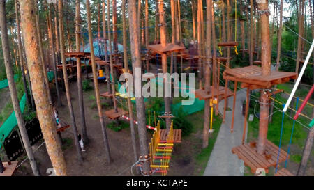 Rope park in the park - knot of rope. high ropes course in forest ...