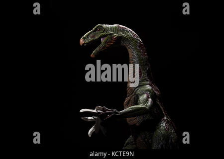 nothronychus toys upper part on a dark background Stock Photo - Alamy
