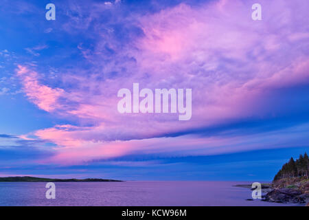 Canada, Nova Scotia, Fox Island. Sunset on rocky shoreline of ...