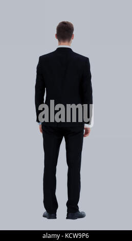 Back view of handsome elegant business man in sneakers walking away and ...