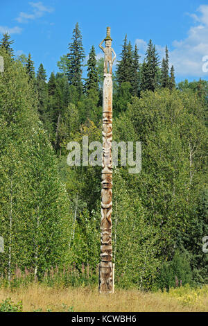 Totem poles and mountains at Kitwanga British Columbia Stock Photo - Alamy