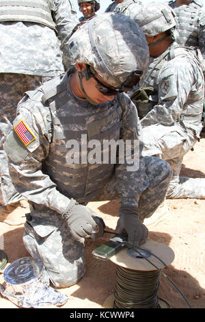 A 40-pound crater charge is set off by Florida National Guardsmen to ...