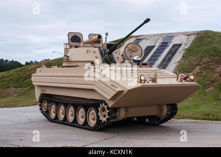 An M113A3/BMP-2 Opposing Forces Surrogate Vehicle stands in a paint ...