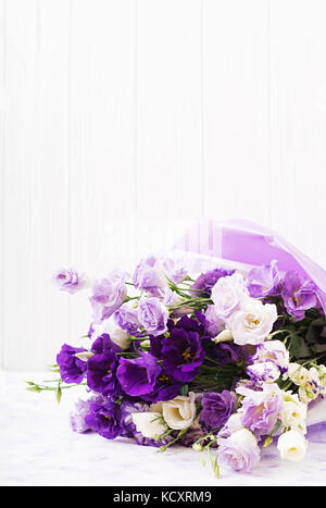 Bunch of white and purple lisianthus gentian flowers Stock Photo - Alamy