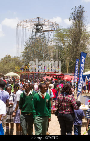 Fairground with rides and people, Nairobi International Trade Fair ...