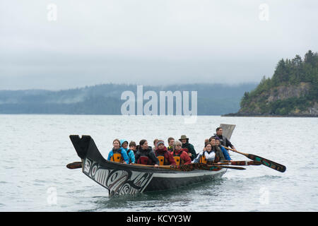 Visitors paddle Loo Plex, replica of the Bill Reid cedar canoe, Lootaas ...